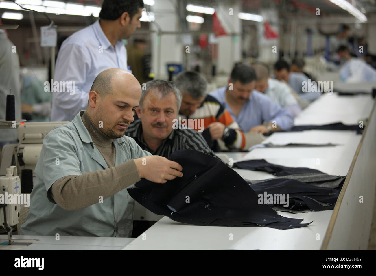 Istanbul, Turkey, people at sewing machines in a textile factory Stock ...