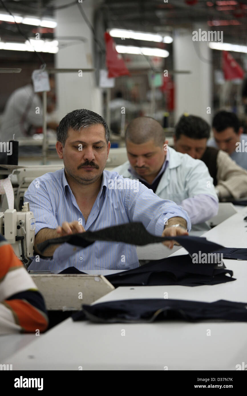 Istanbul, Turkey, people at sewing machines in a textile factory Stock ...