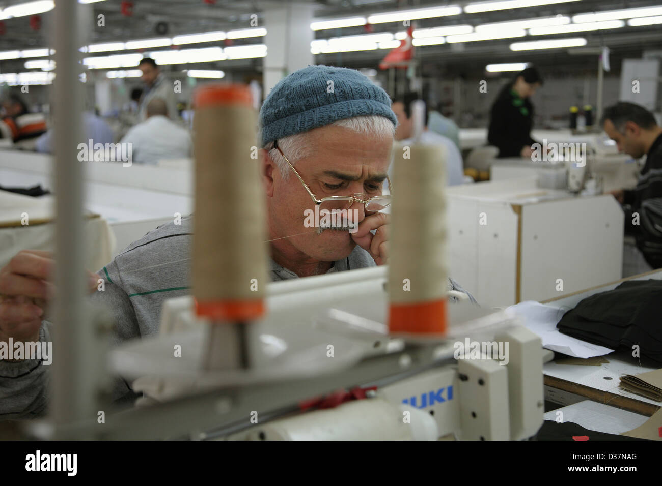 Istanbul, Turkey, an employee at a sewing machine in a textile mill ...