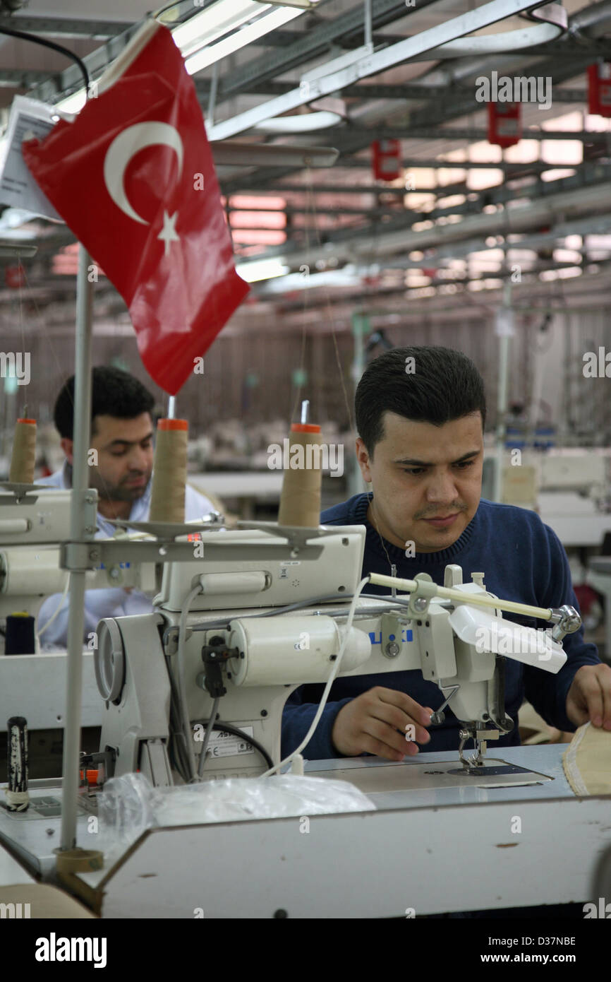 Istanbul, Turkey, an employee at a sewing machine in a textile mill ...