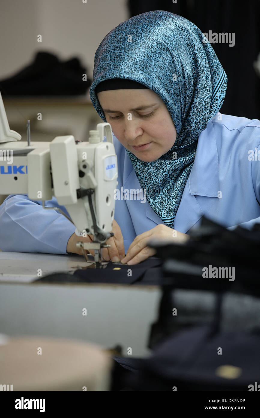 Istanbul, Turkey, associate at a sewing machine in a textile mill Stock ...