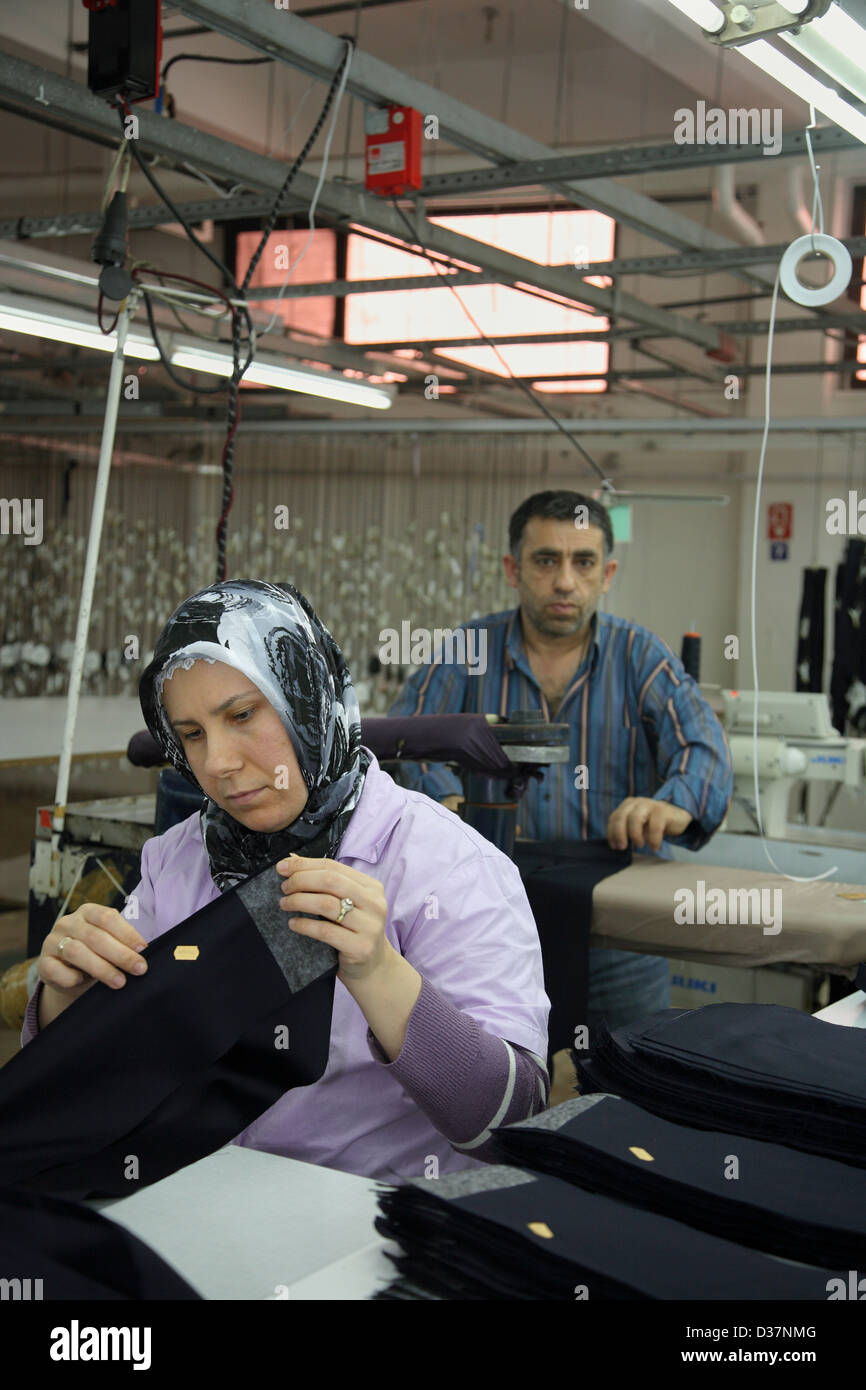 Istanbul, Turkey, people at sewing machines in a textile factory Stock ...
