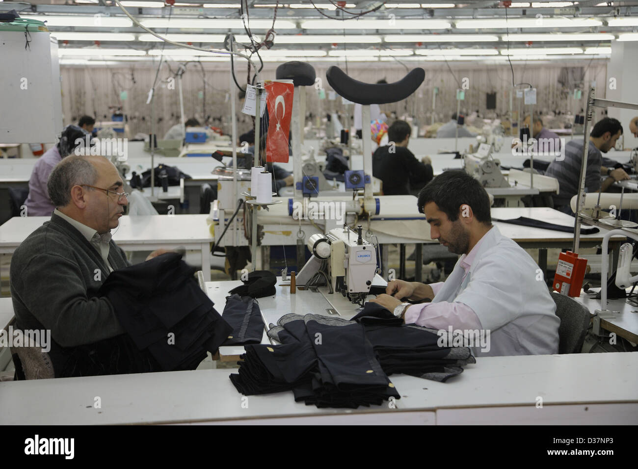 Istanbul, Turkey, people at sewing machines in a textile factory Stock ...