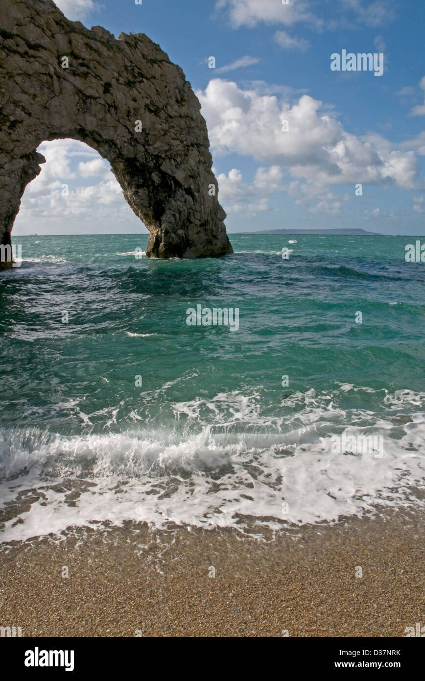 The pebble beach at Durdle Door on the Dorset coast, with the Isle of ...