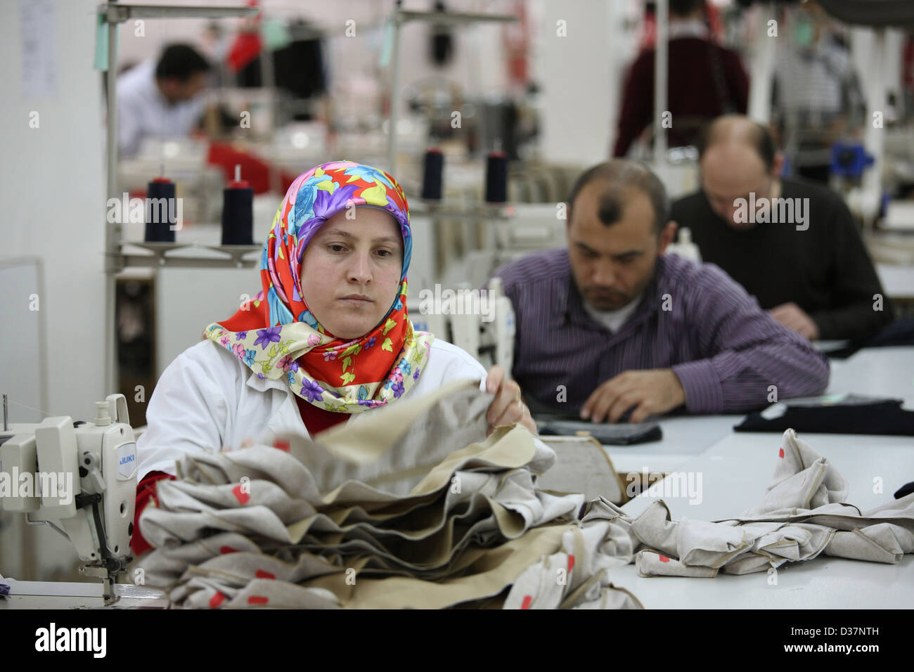 Istanbul, Turkey, people at sewing machines in a textile factory Stock ...