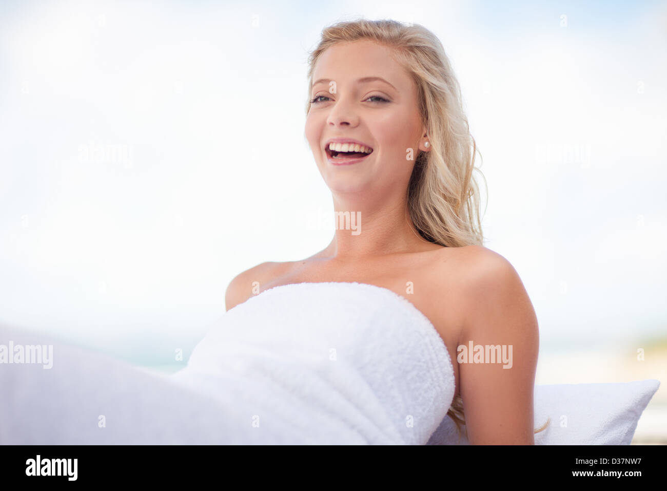 Smiling woman relaxing outdoors Stock Photo - Alamy