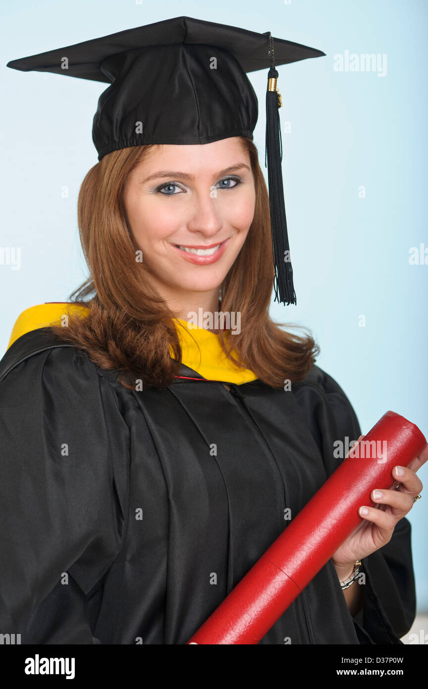 Portrait of graduate student holding diploma Stock Photo - Alamy