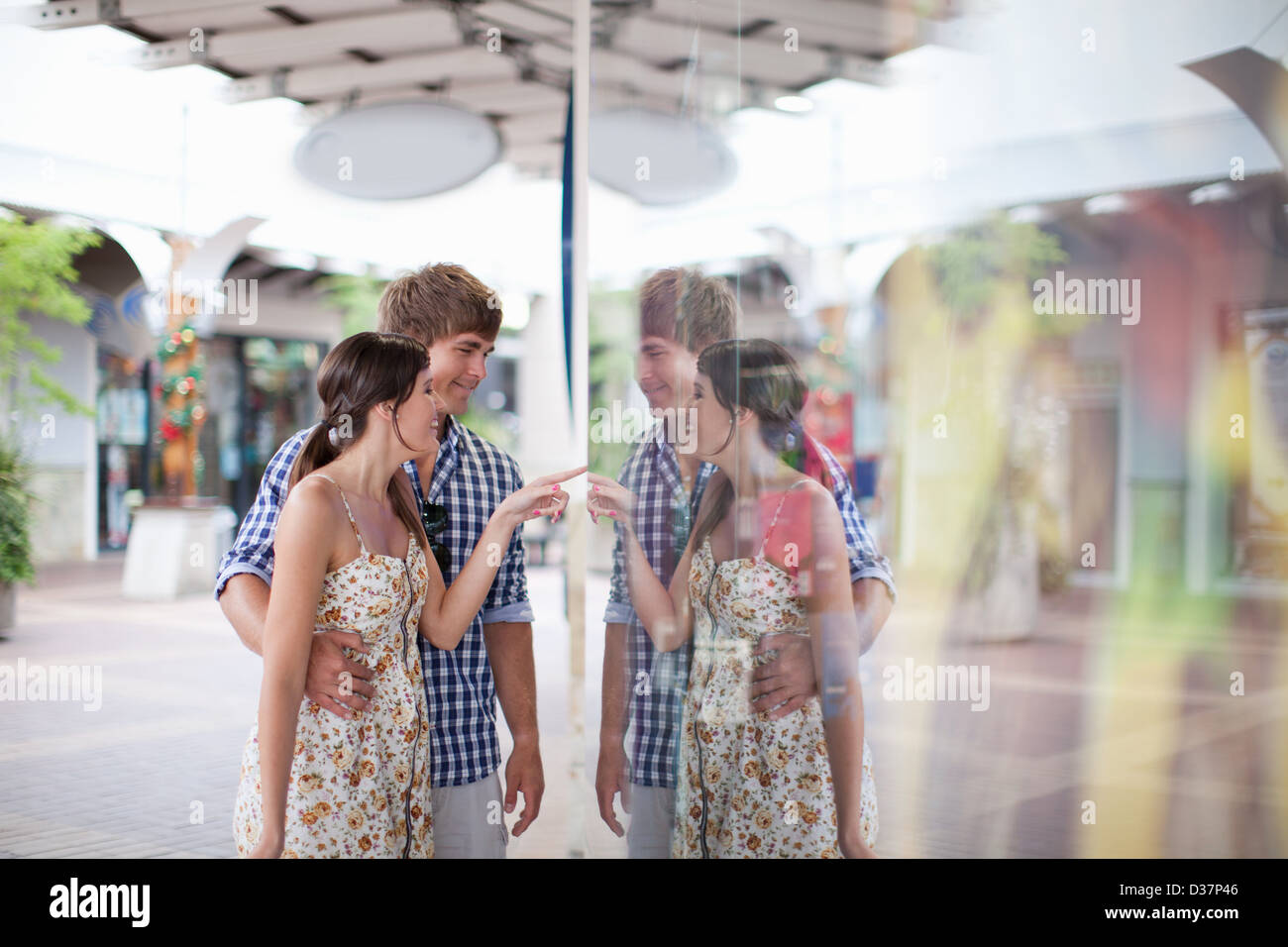 Couple window shopping together Stock Photo - Alamy