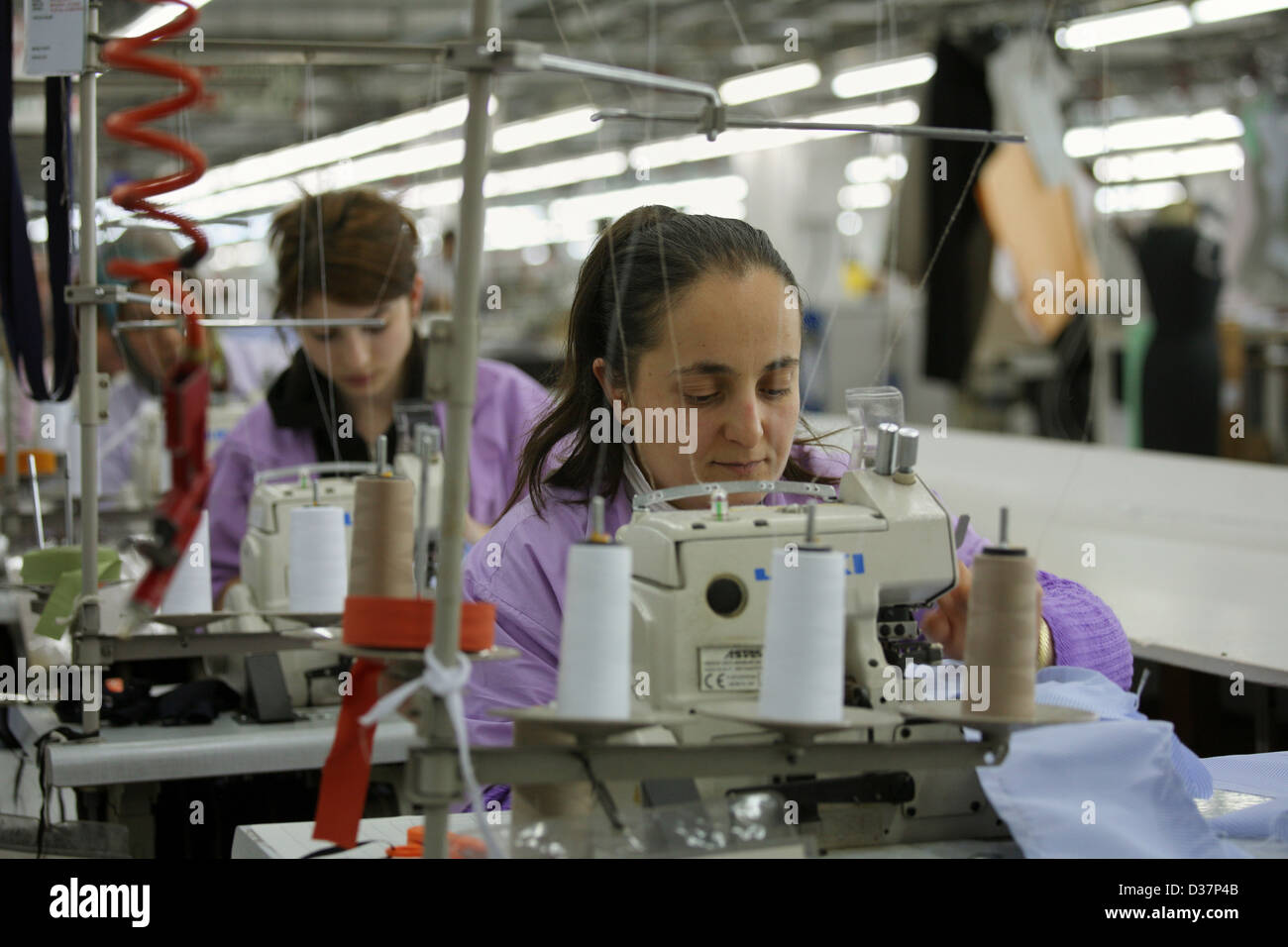 Istanbul, Turkey, people at sewing machines in a textile factory Stock ...