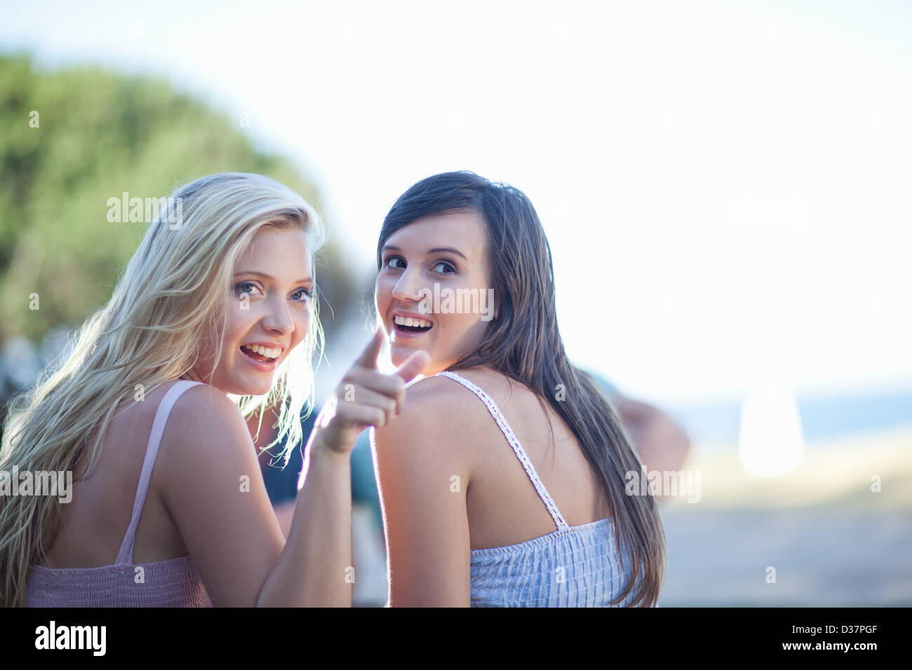 Smiling women talking outdoors Stock Photo - Alamy