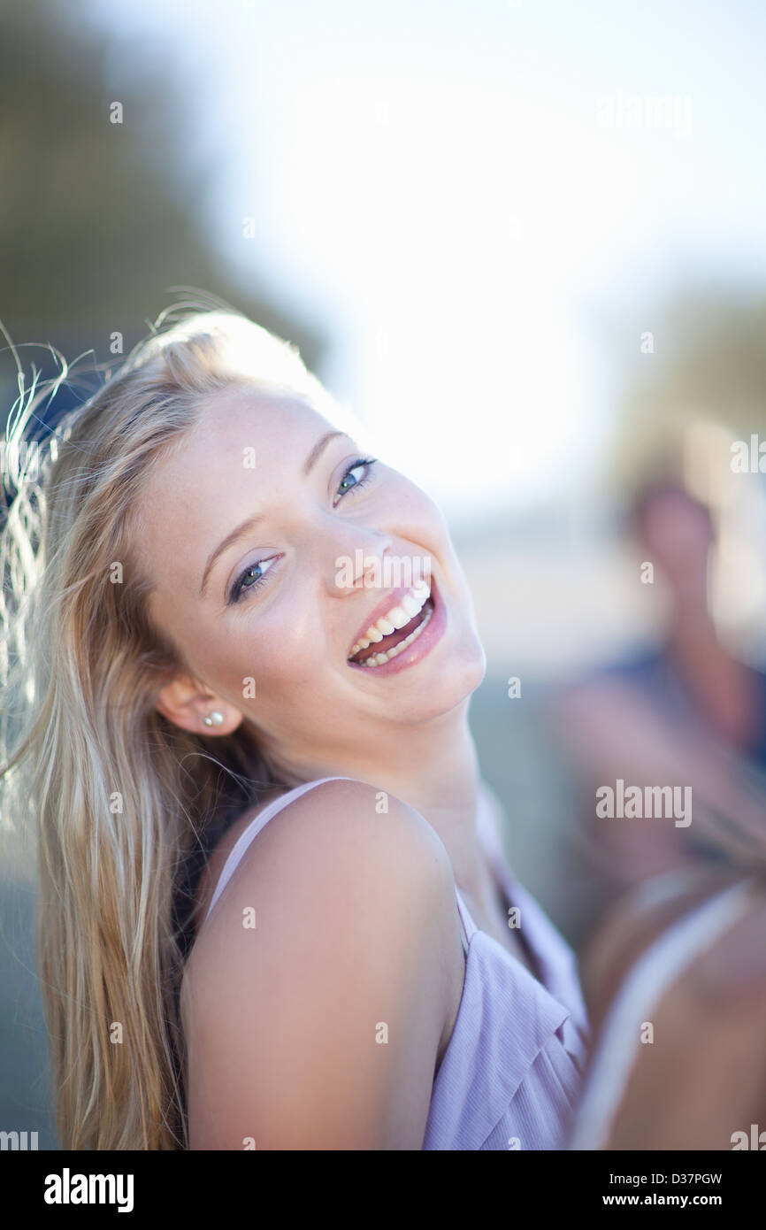 Woman laughing outdoors Stock Photo - Alamy