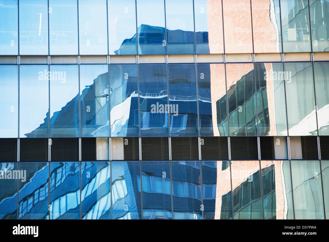 Building reflected in urban skyscraper Stock Photo - Alamy
