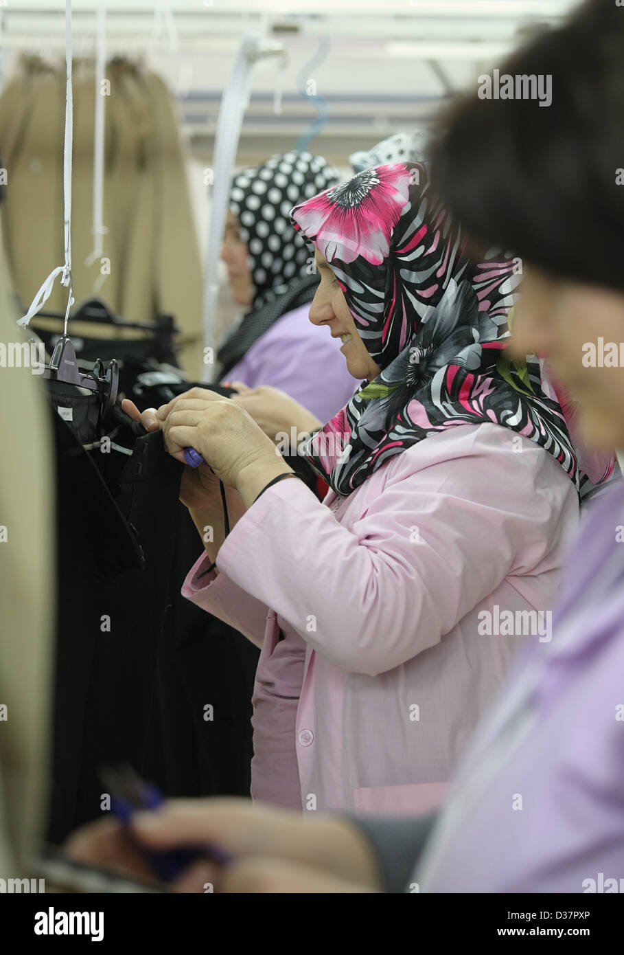 Istanbul, Turkey, employees work pants in a garment factory Stock Photo ...