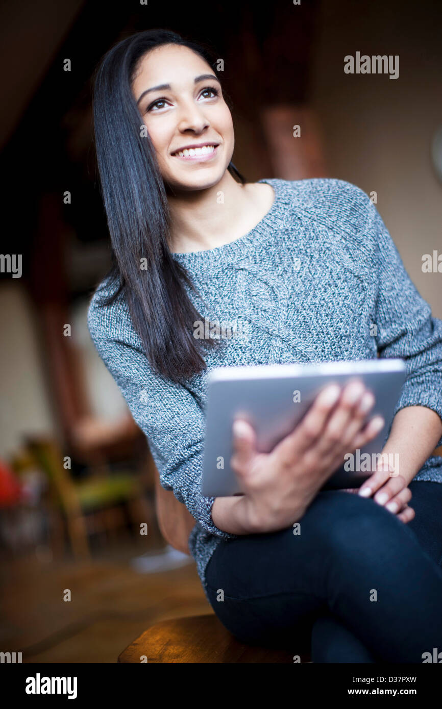 Woman using tablet computer Stock Photo - Alamy