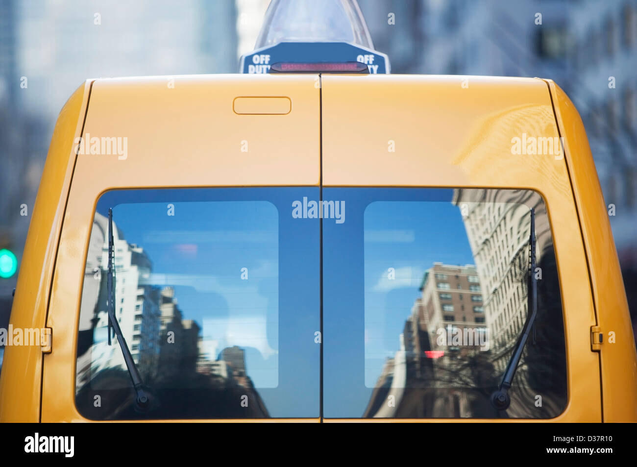 USA, New York State, New York City, Reflection in rear window of yellow ...