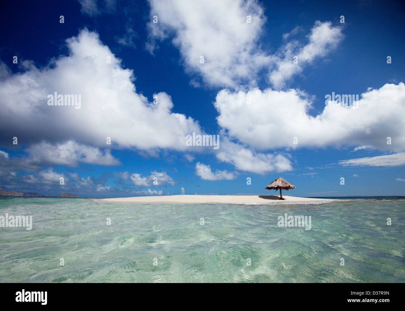 Clouds over sandbar and tropical water Stock Photo - Alamy