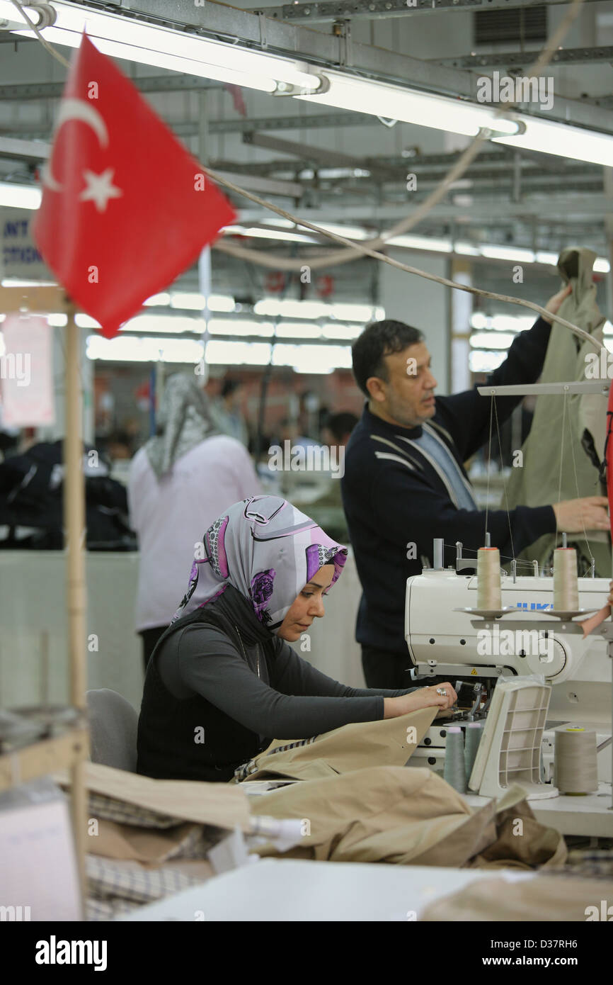 Istanbul, Turkey, people at sewing machines in a textile factory Stock ...
