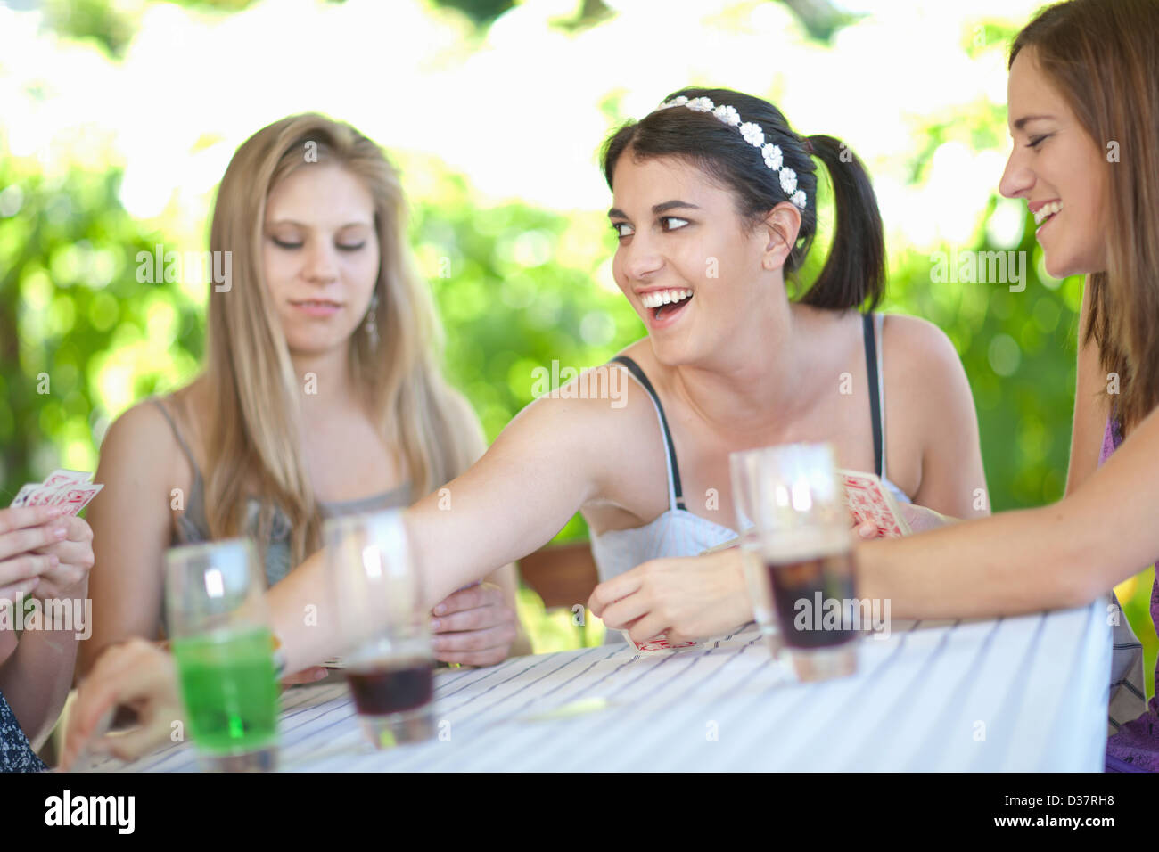 Women playing cards at table Stock Photo - Alamy