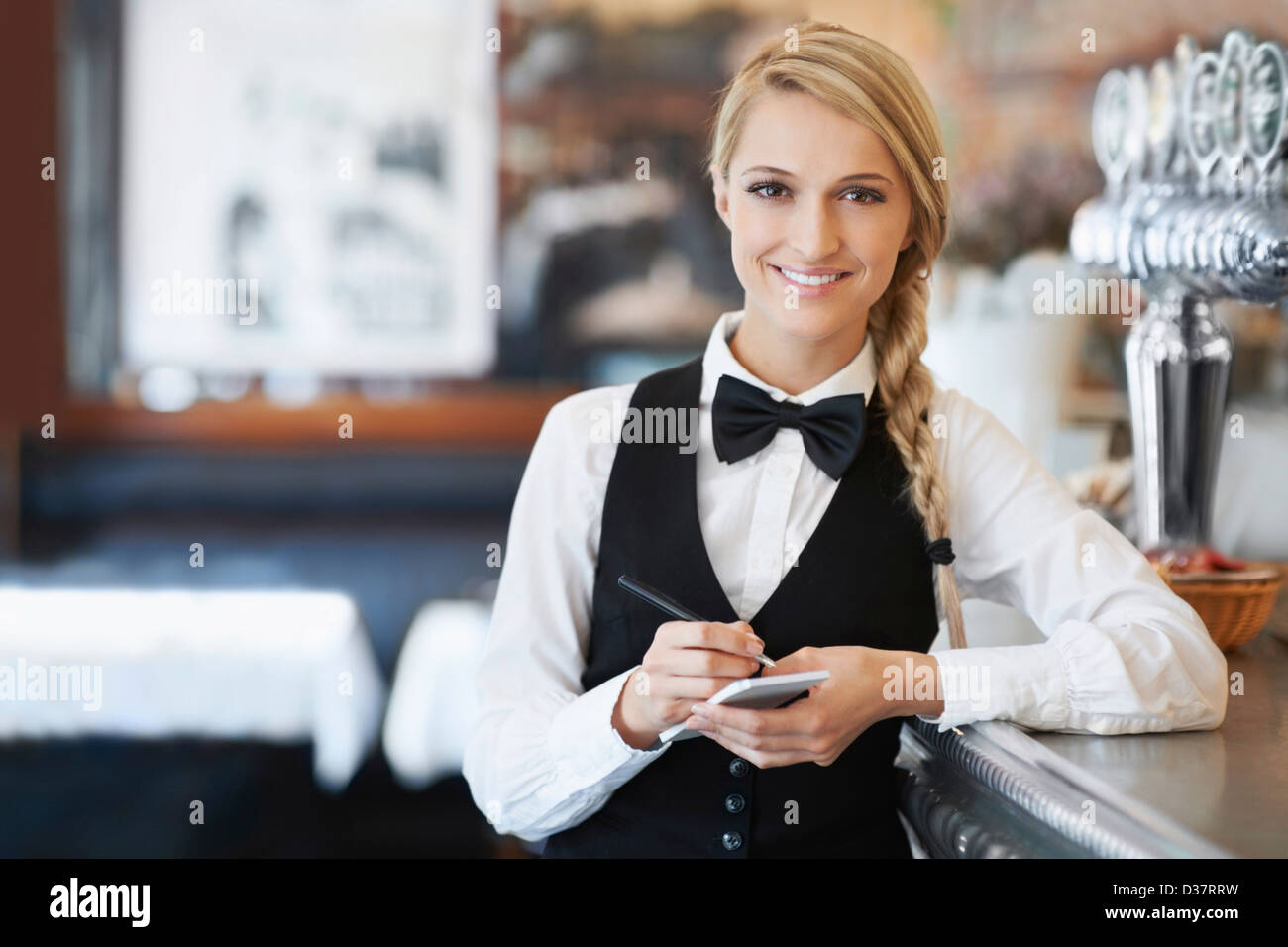 Denmark, Aarhus, Portrait of smiling waitress Stock Photo - Alamy