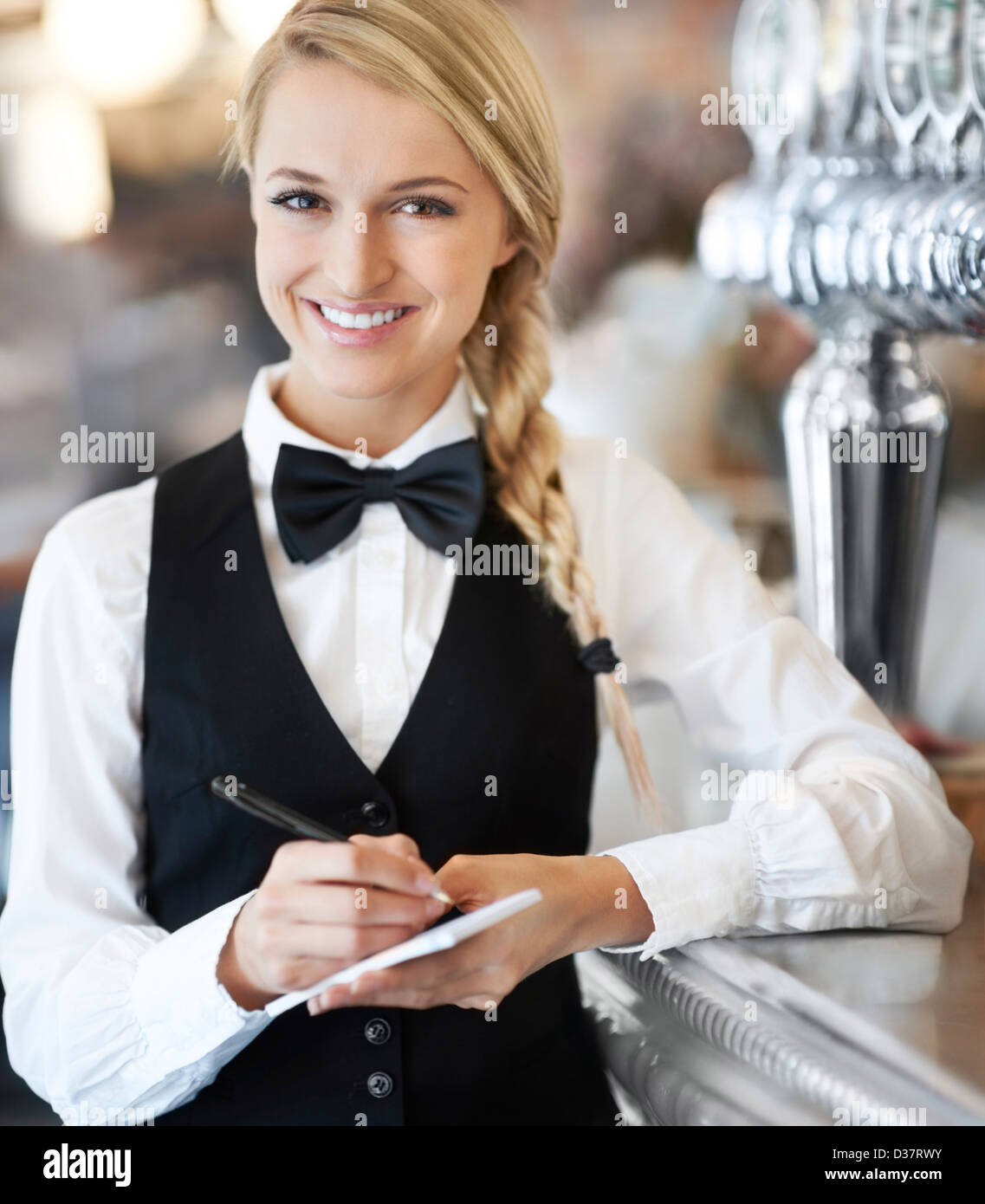 Denmark, Aarhus, Portrait of smiling waitress Stock Photo - Alamy