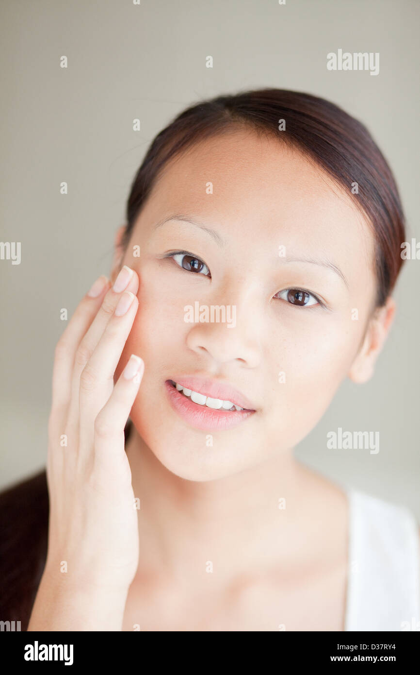 Beautiful female face moisturizing hi-res stock photography and images ...