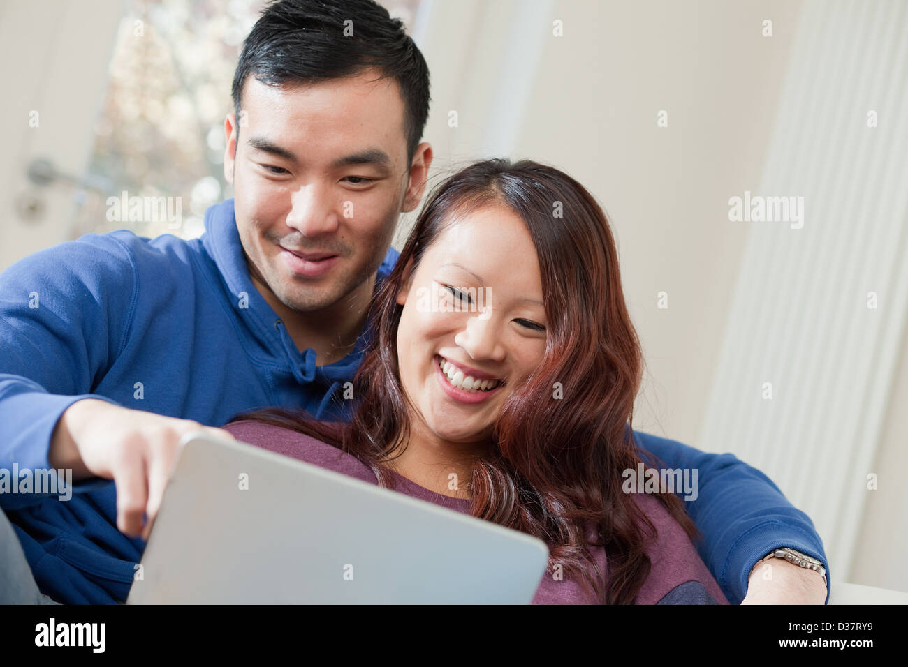Couple using tablet computer together Stock Photo - Alamy