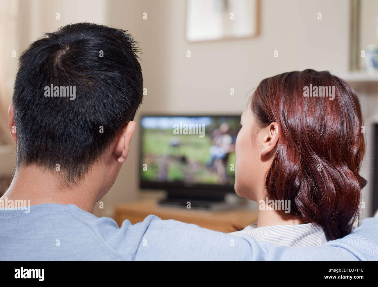 Couple watching television together Stock Photo - Alamy