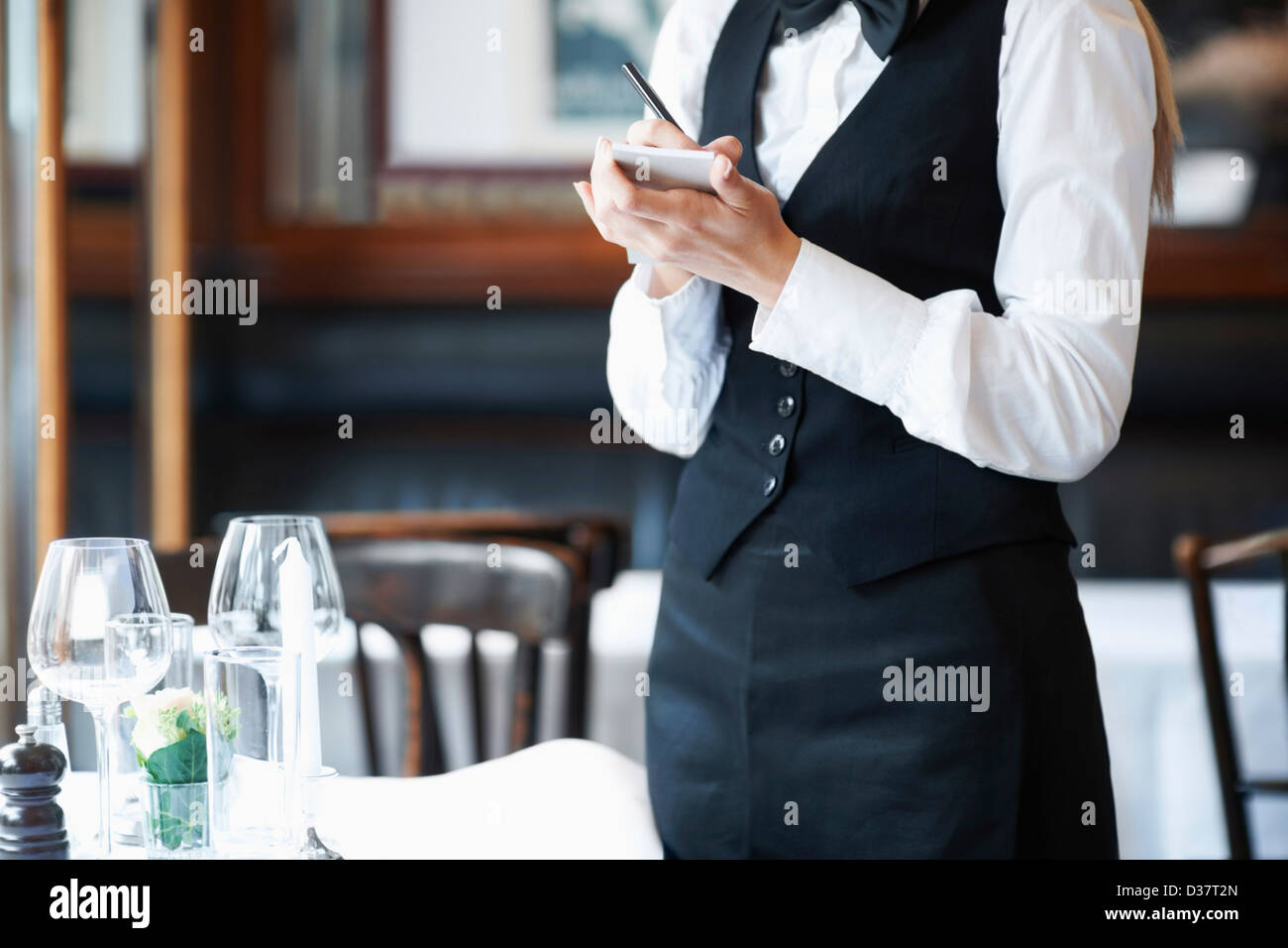 Denmark, Aarhus, Young waitress taking order Stock Photo - Alamy