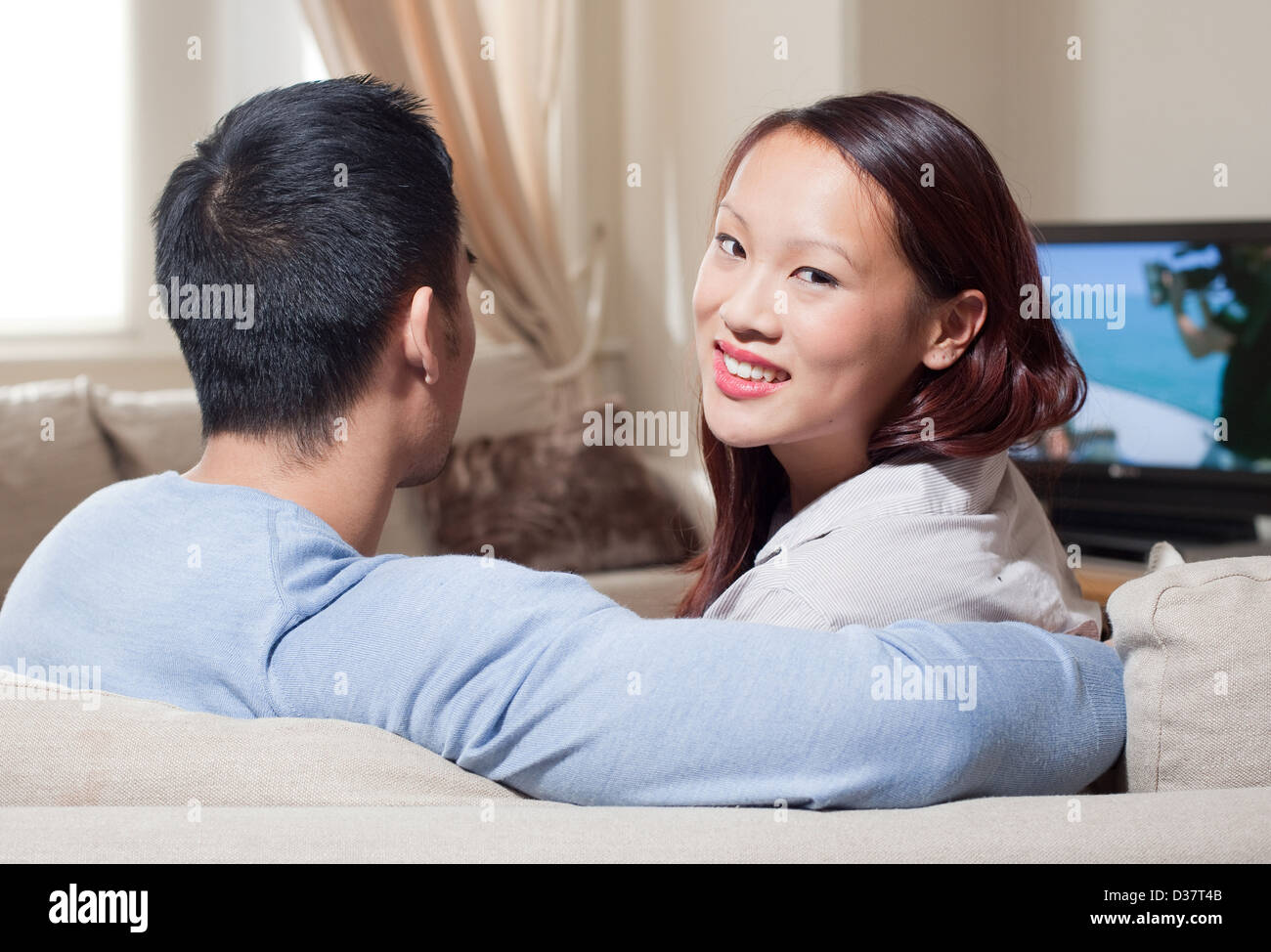 Couple watching television together Stock Photo - Alamy