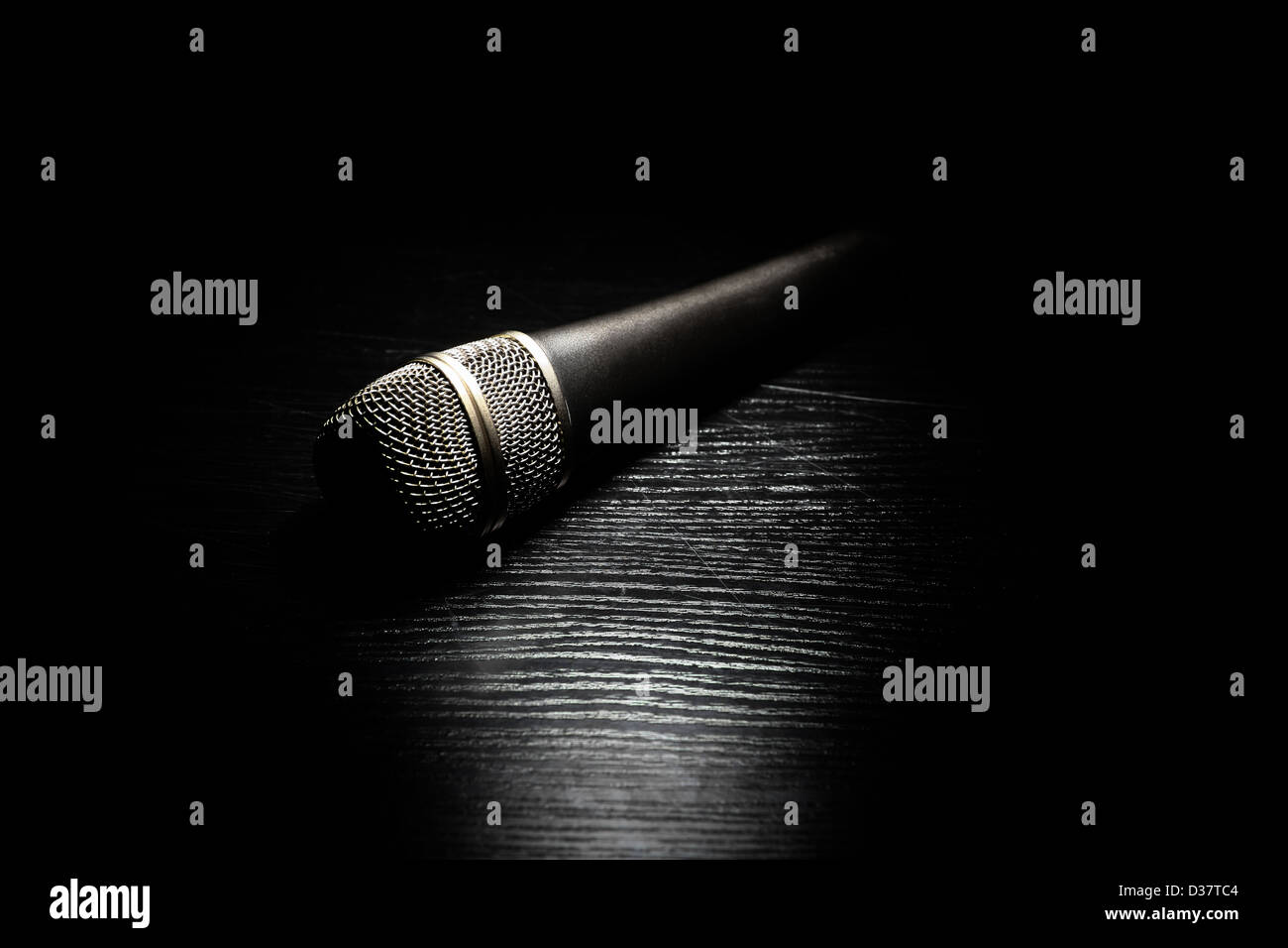 Studio shot of a microphone, on black Stock Photo - Alamy