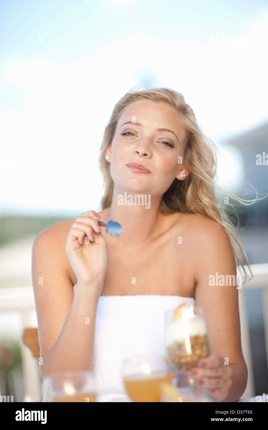 Woman eating breakfast outdoors Stock Photo - Alamy