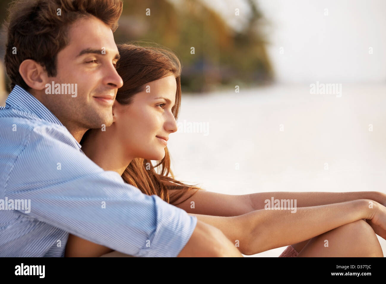 Two females sitting down hugging hi-res stock photography and images ...