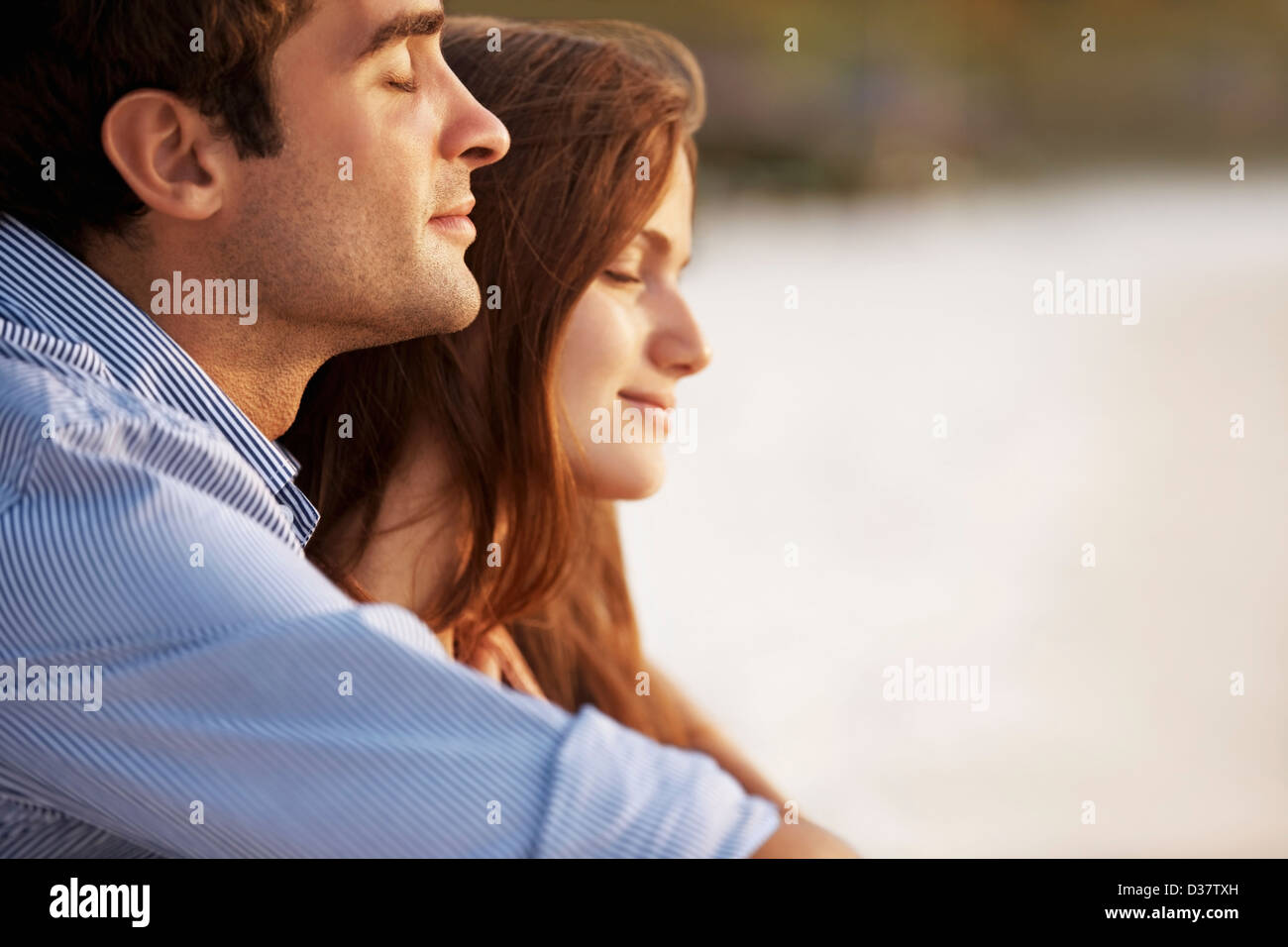 Two females sitting down hugging hi-res stock photography and images ...