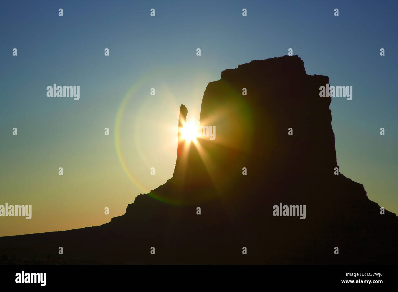 East Mitten and sunburst, Monument Valley, Arizona Utah border USA ...