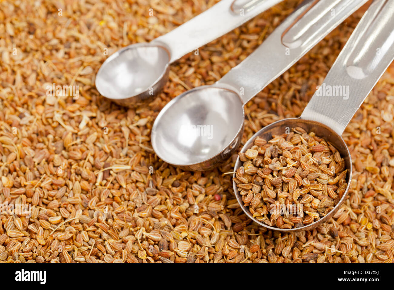 Anise seed in metal scoop on aniseed background Stock Photo - Alamy