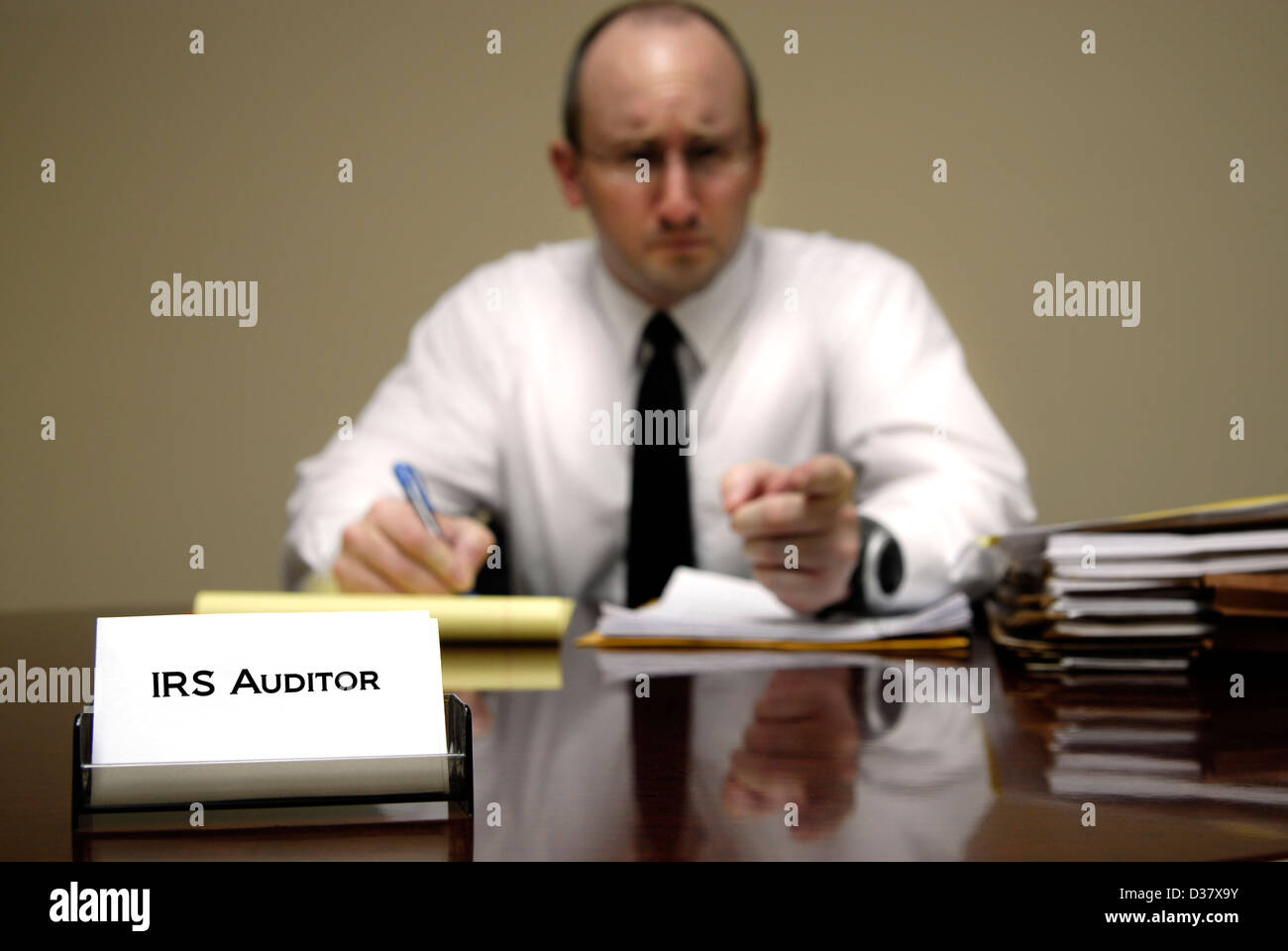 IRS tax auditor man with a stern or mean expression Stock Photo - Alamy
