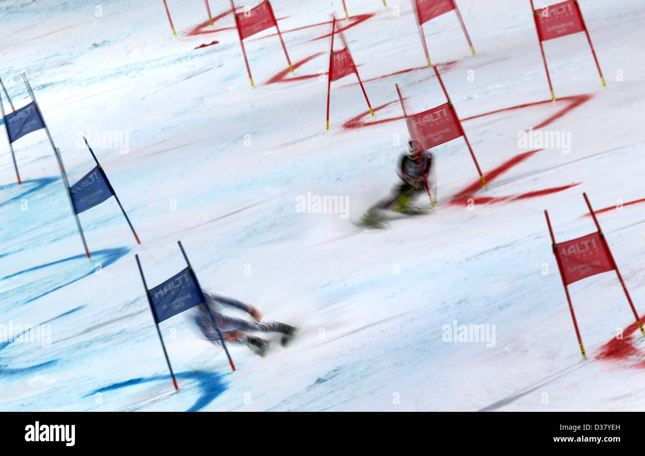 Two skiers in action during the Nations Team Event at the Alpine Skiing ...