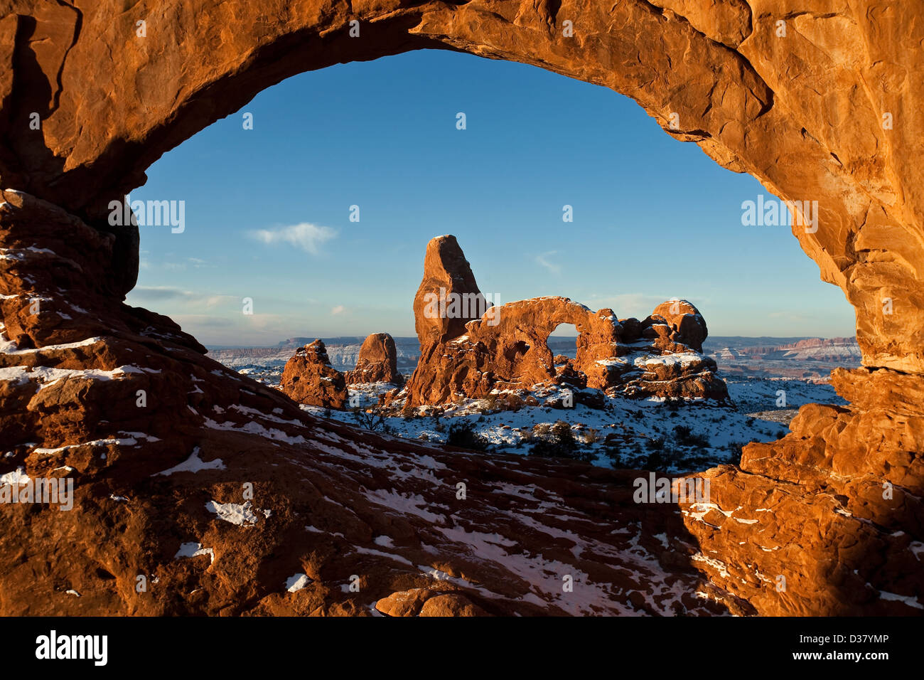 The first light of dawn illuminates Turret Arch, framed by the North ...