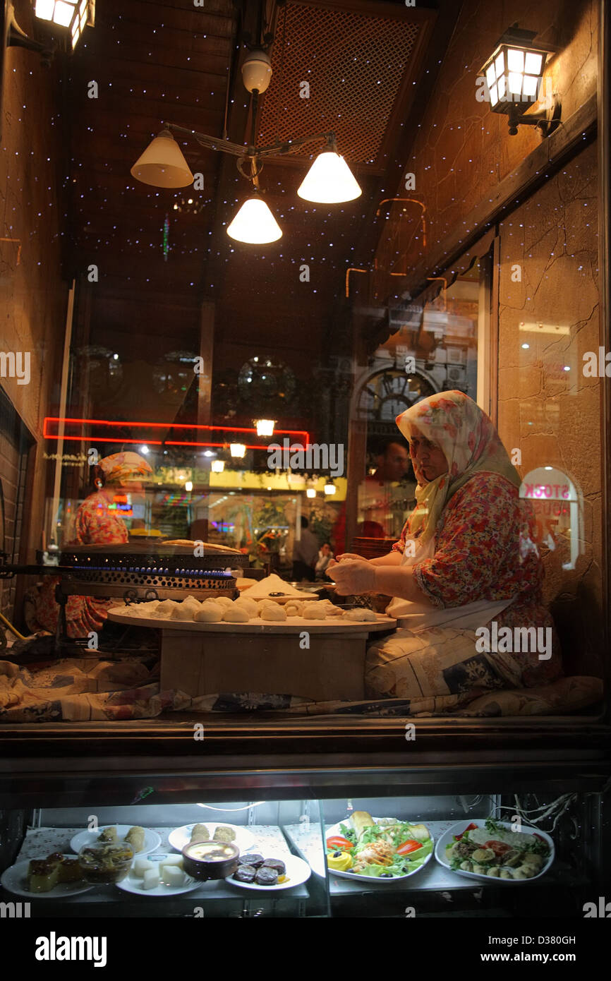 Istanbul, Turkey, woman in the shop window in the preparation of bread ...