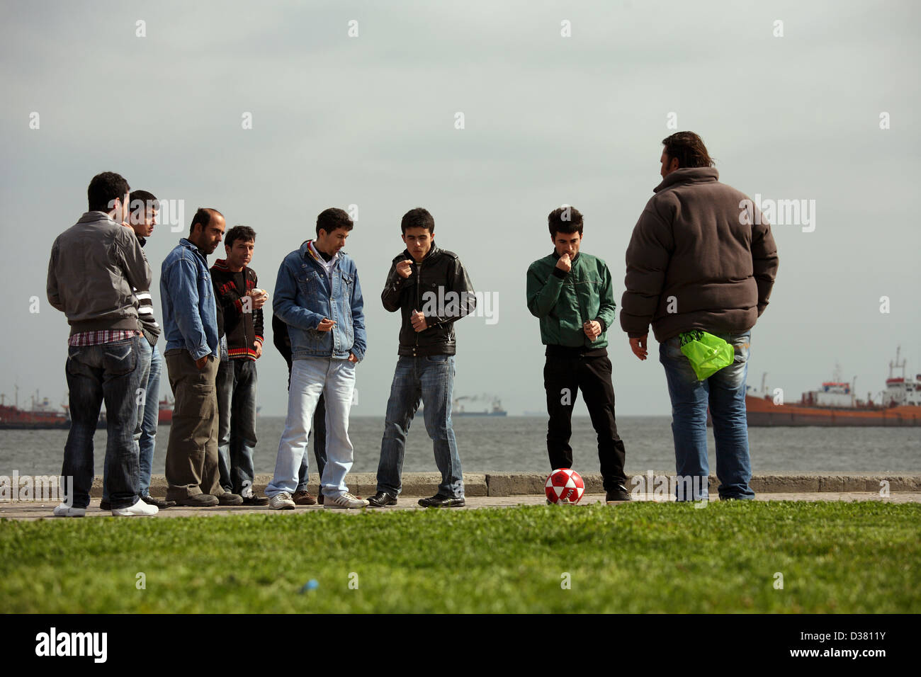 Istanbul, Turkey, young men on the Sunday promenade on the Marmara Sea ...