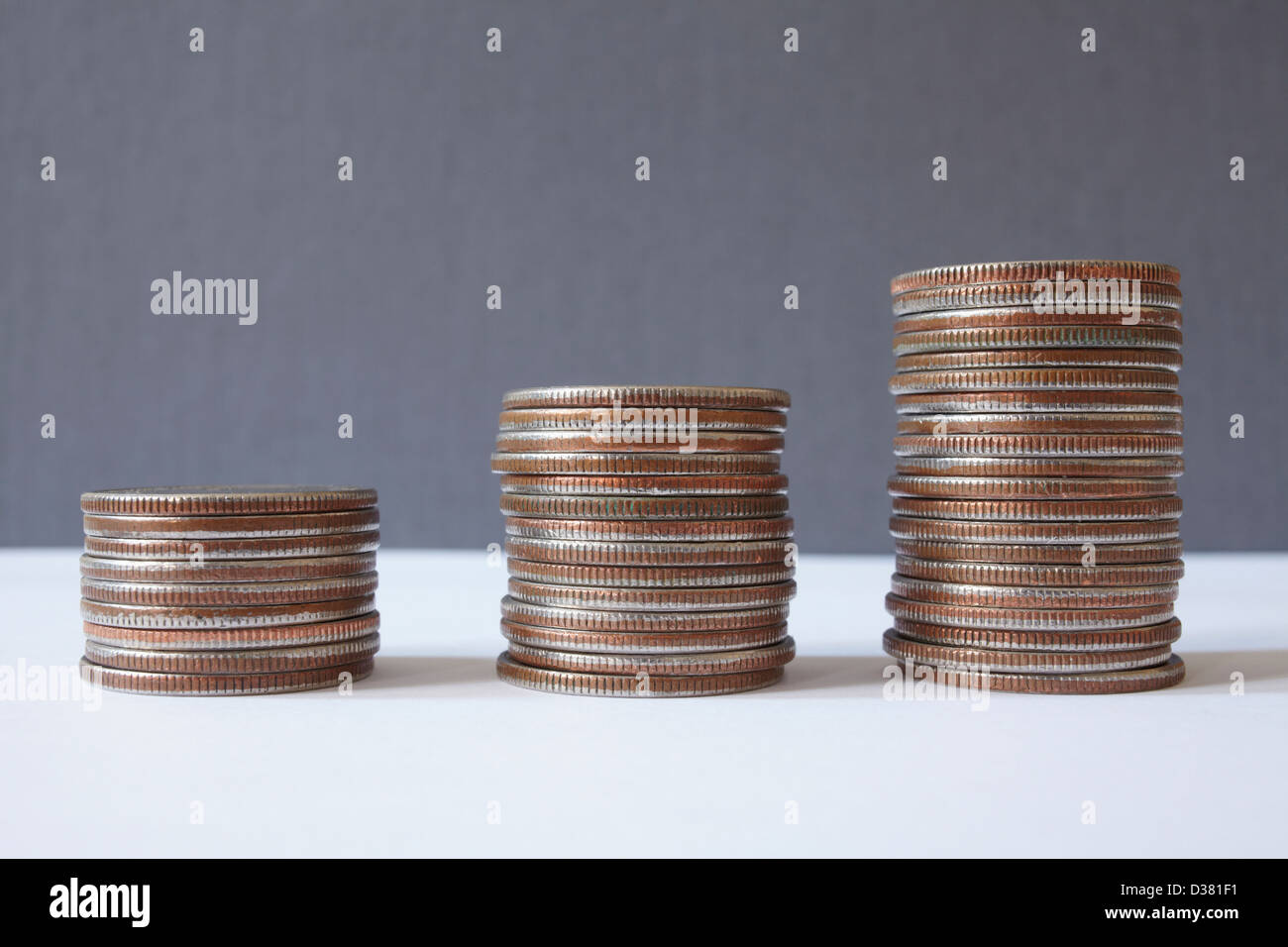 Coins arranged as bar chart Stock Photo - Alamy