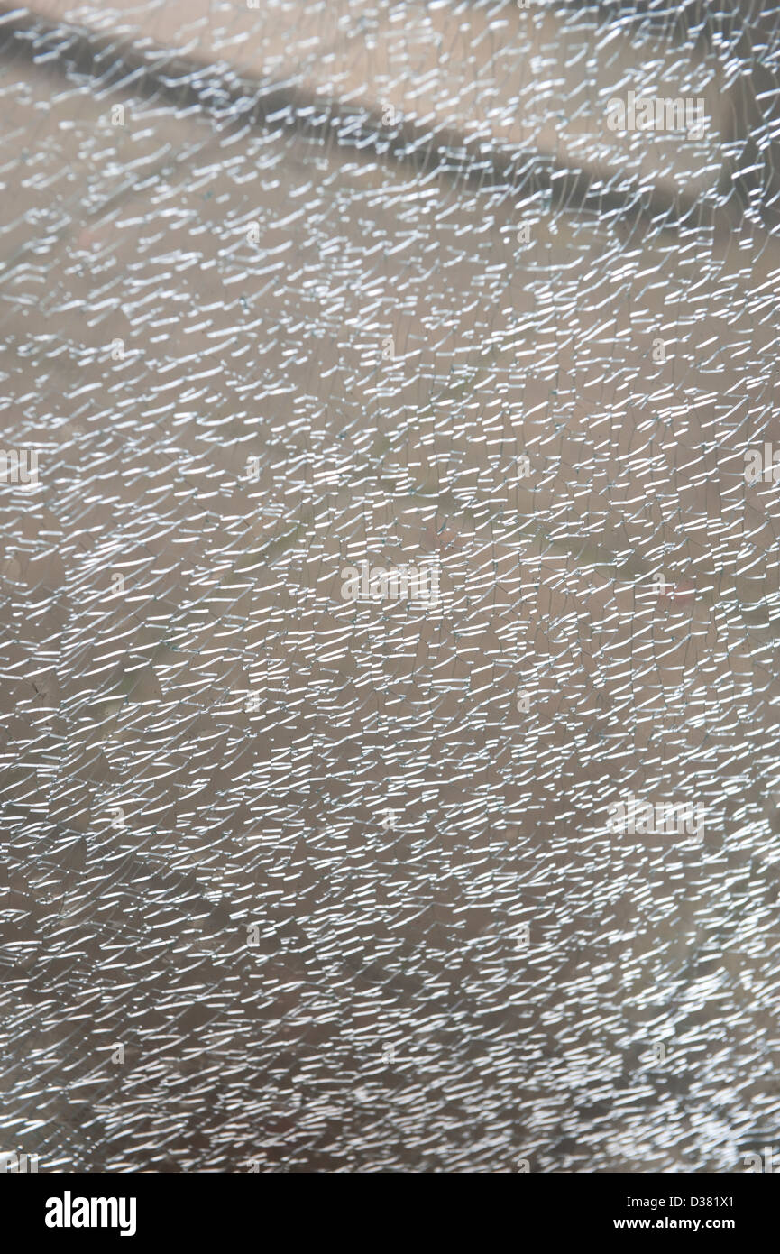 Smashed crazed broken glass double glazed window Stock Photo - Alamy