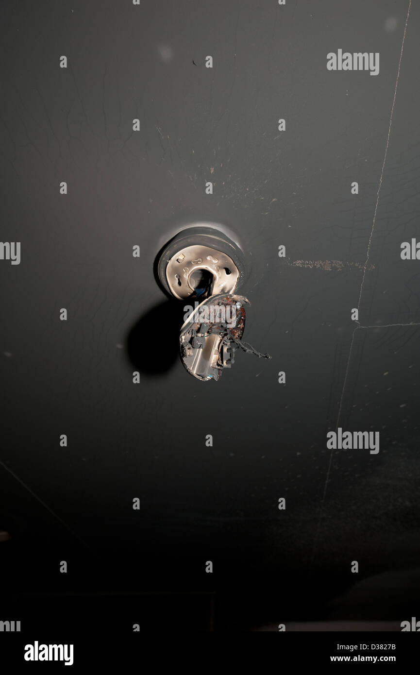 Burnt melted smoke alarm after severe domestic house fire Stock Photo ...