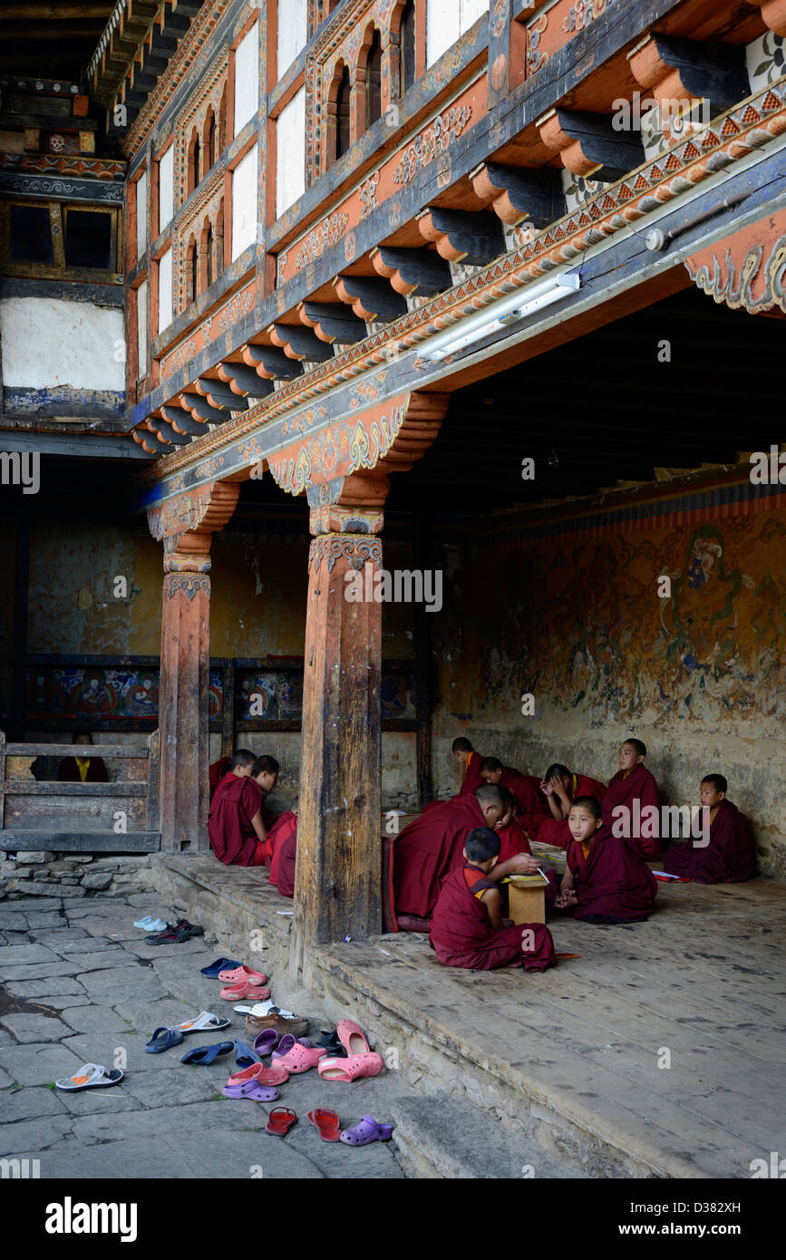 Student monks practice prayers/chants with teacher.Croc type shoes ...