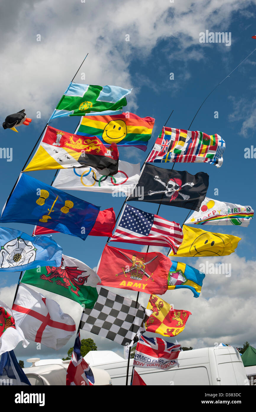 Multicoloured flags lots against blue sky windy Stock Photo - Alamy