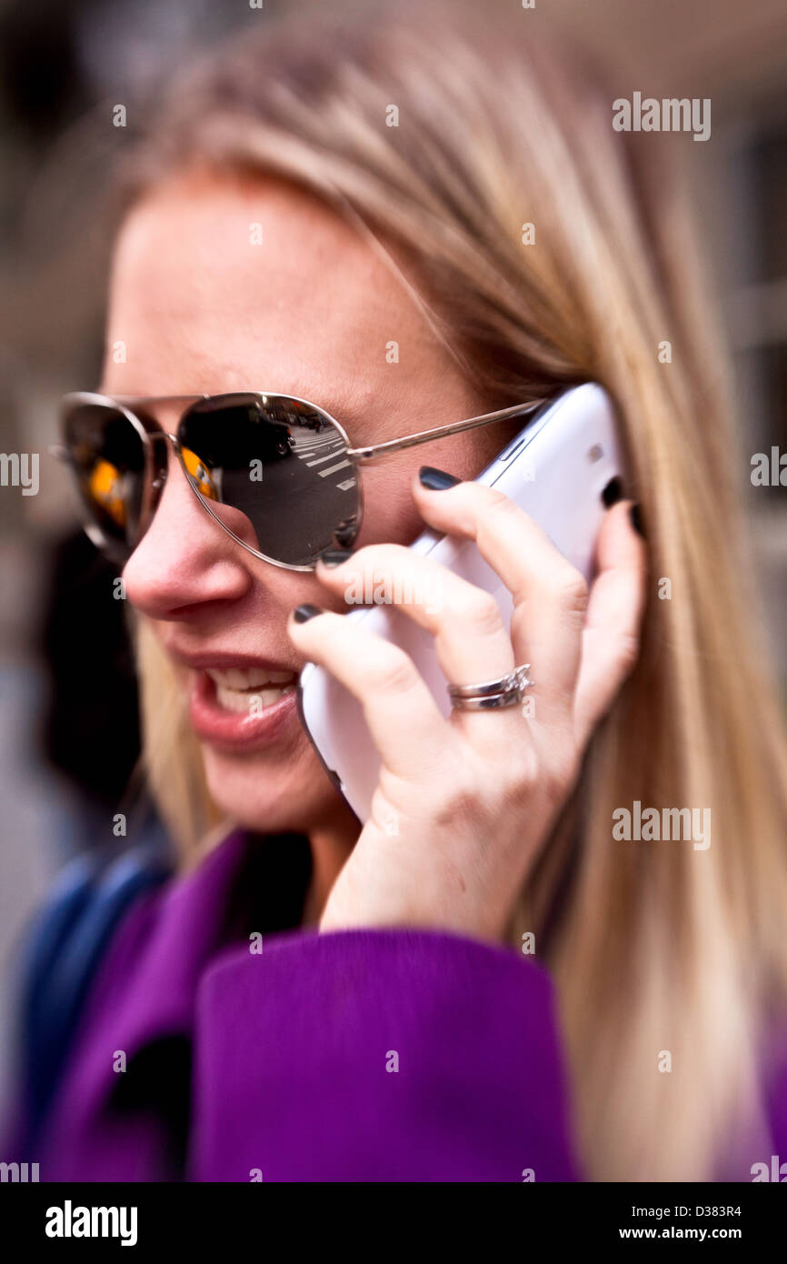 Young Woman talking on phone outside on a Fall Day Stock Photo - Alamy