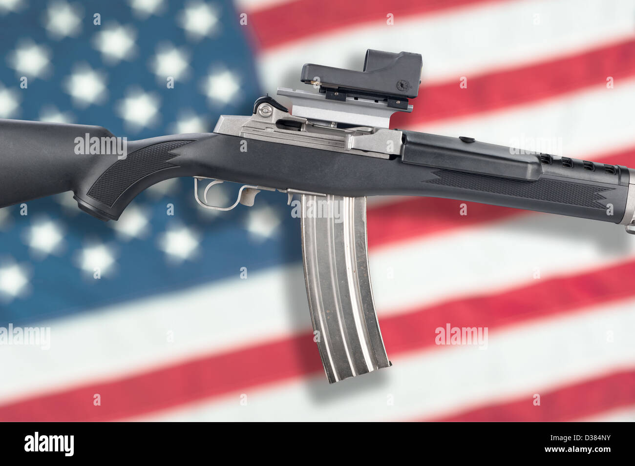An assault rifle isolated over an American flag Stock Photo - Alamy