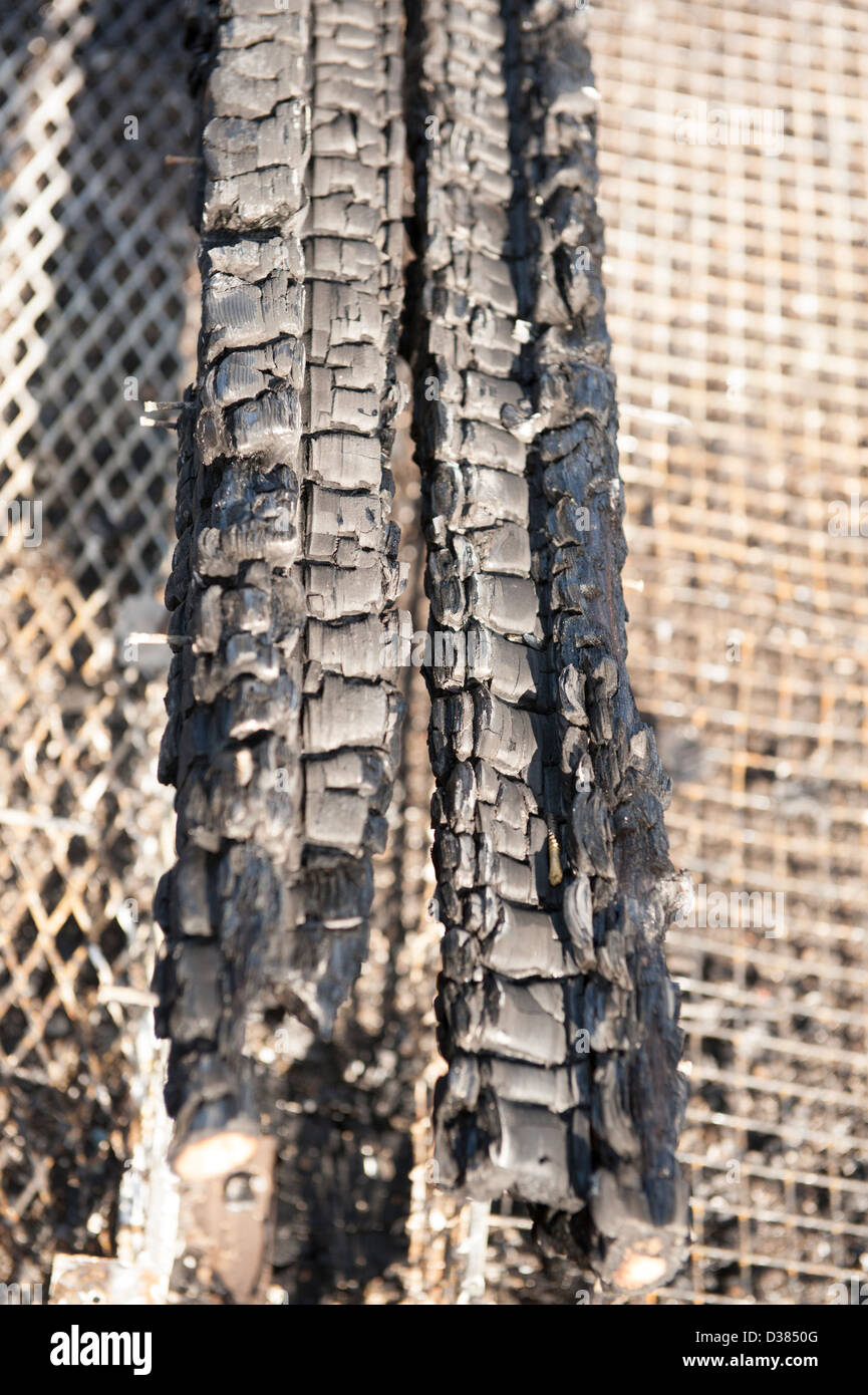 Badly burnt charred destroyed wood timber window frame Stock Photo - Alamy