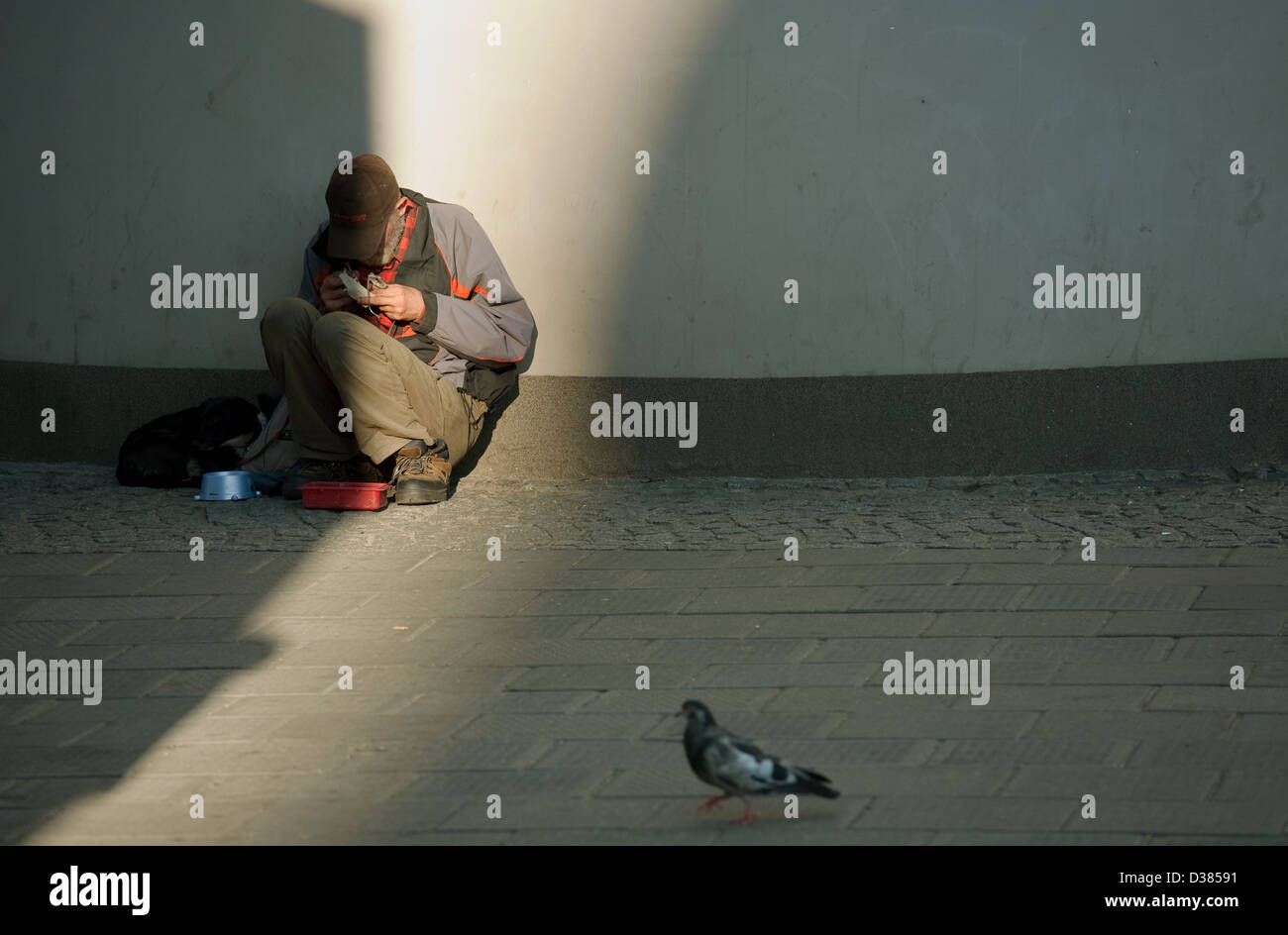 Poznan, Poland, a homeless man on a street in the city center Stock ...