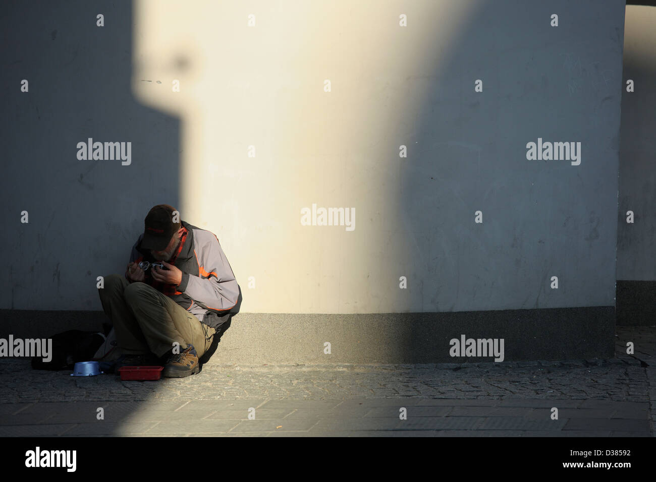 Poznan, Poland, a homeless man on a street in the city center Stock ...